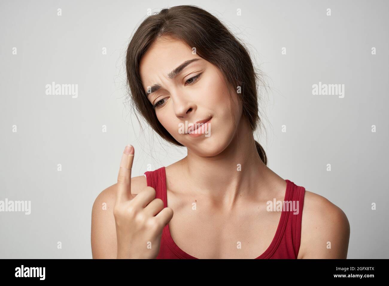 woman showing index finger injury health problems close-up Stock Photo ...