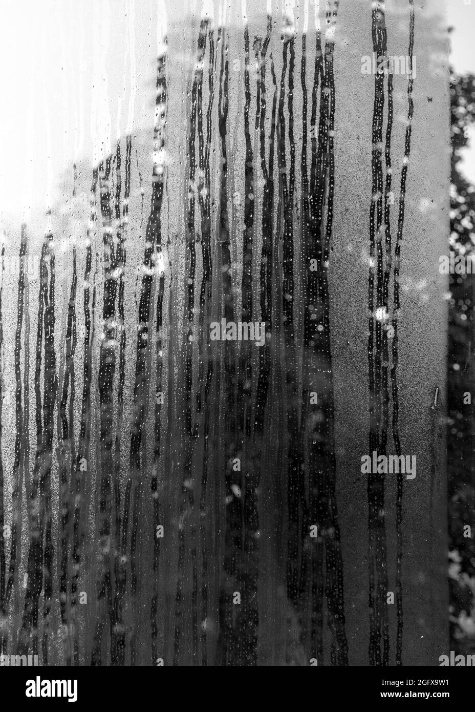 abstract photography with wet and sweaty window, raindrop texture ...
