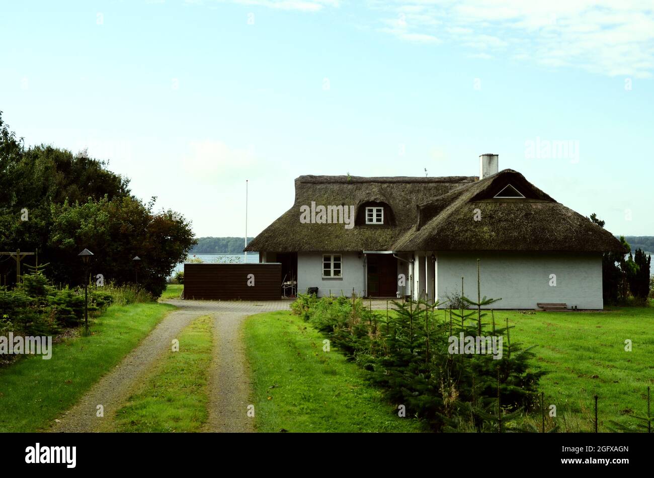 Beautiful view of a small rural house with a green garden Stock Photo ...
