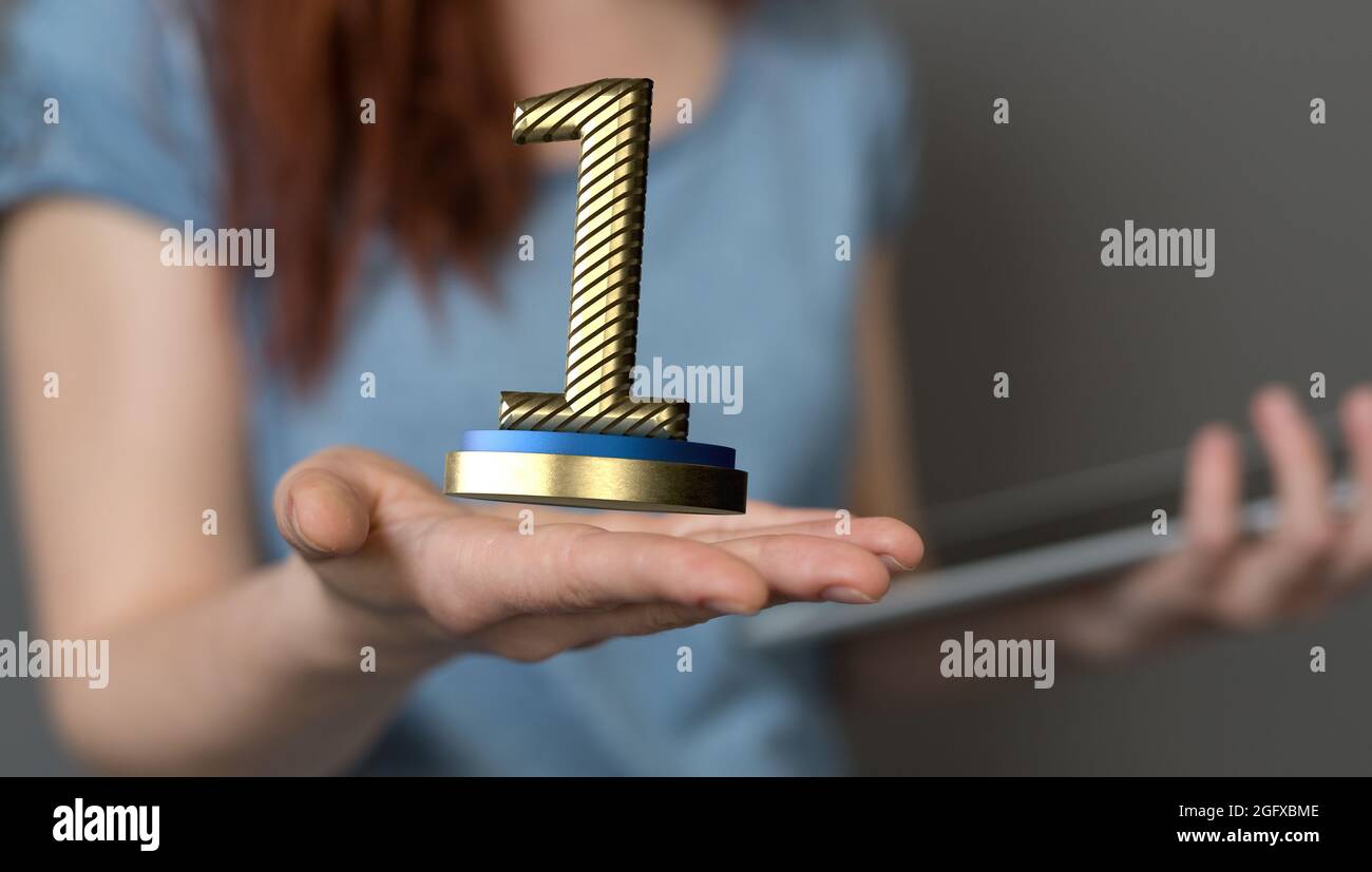 Success gold winner first place in hand Stock Photo - Alamy