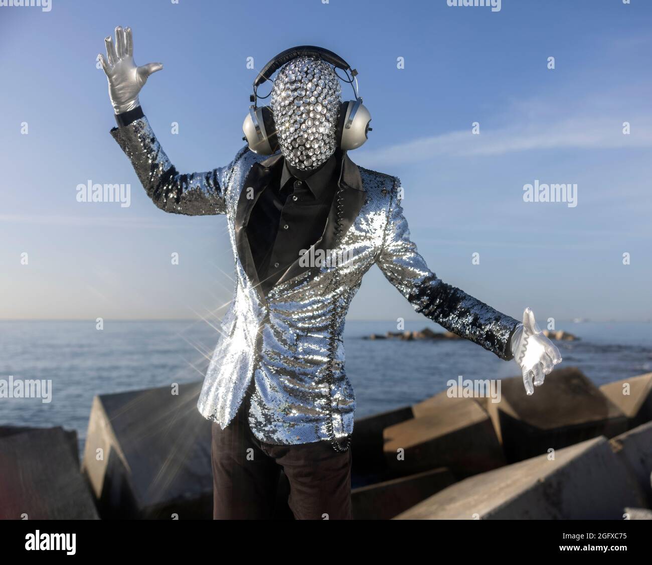Mr disco man with sparkly face and headphones Stock Photo - Alamy