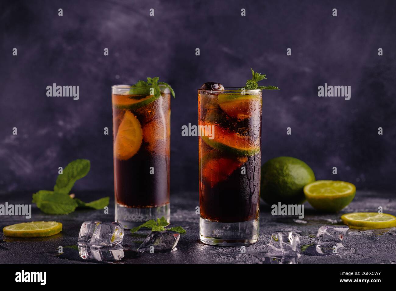 Rum and Cola cocktail Cuba Libre with lime and ice Stock Photo - Alamy
