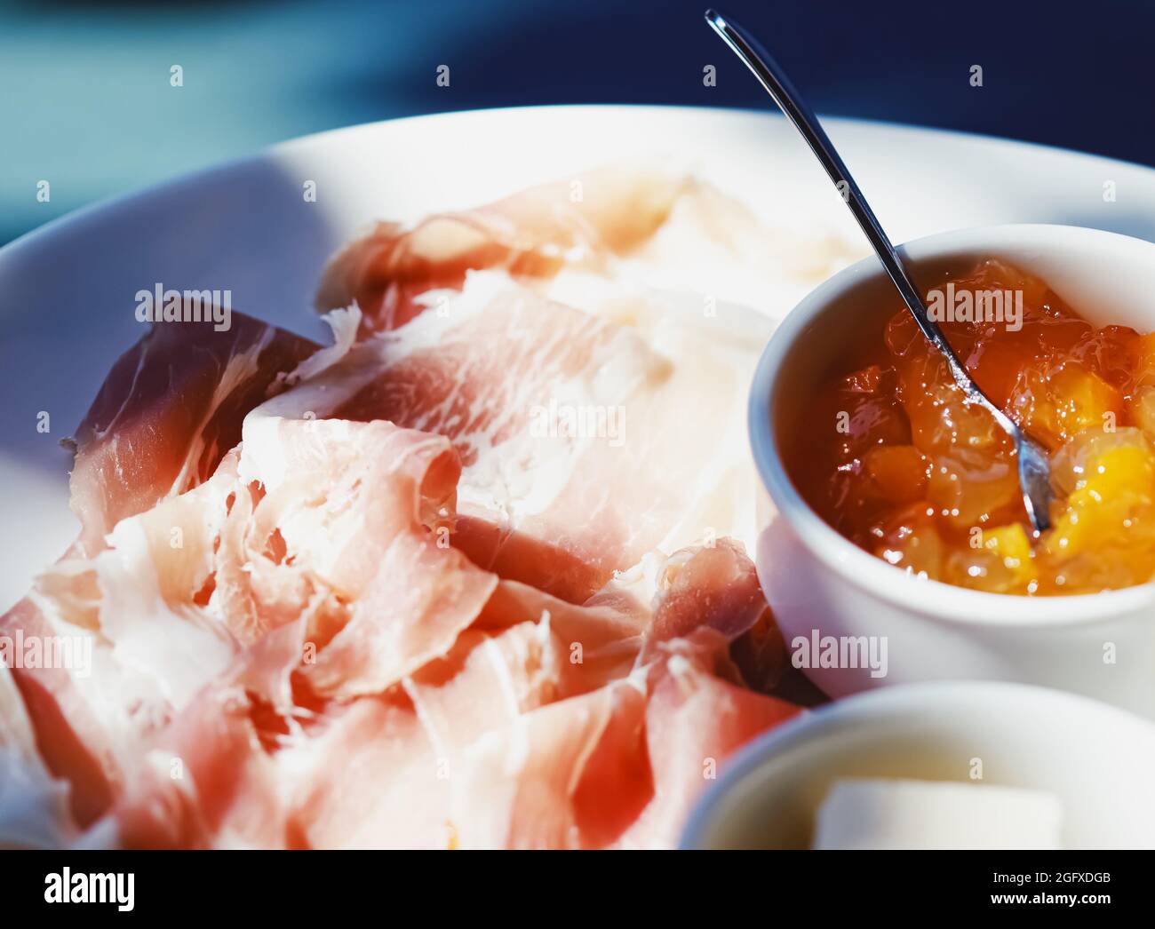 Breakfast outdoors in summer, ham, jam, butter and ham Stock Photo - Alamy