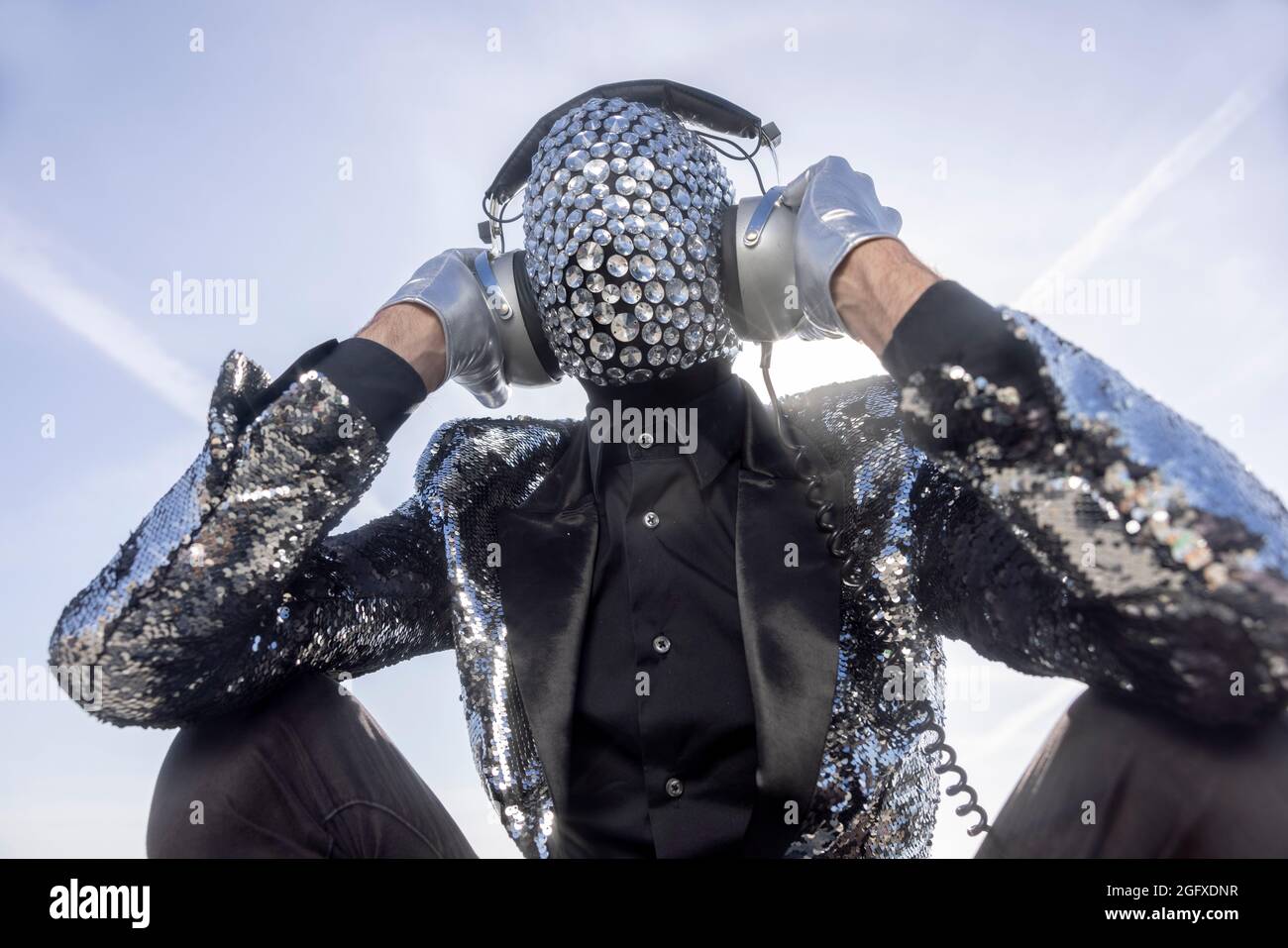 Mr disco man with sparkly face and headphones Stock Photo - Alamy