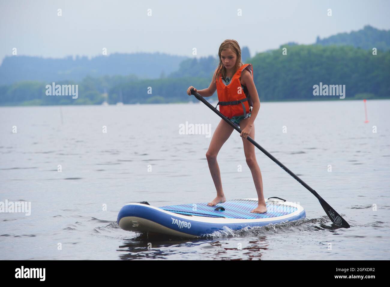 Children paddle board hi-res stock photography and images - Alamy