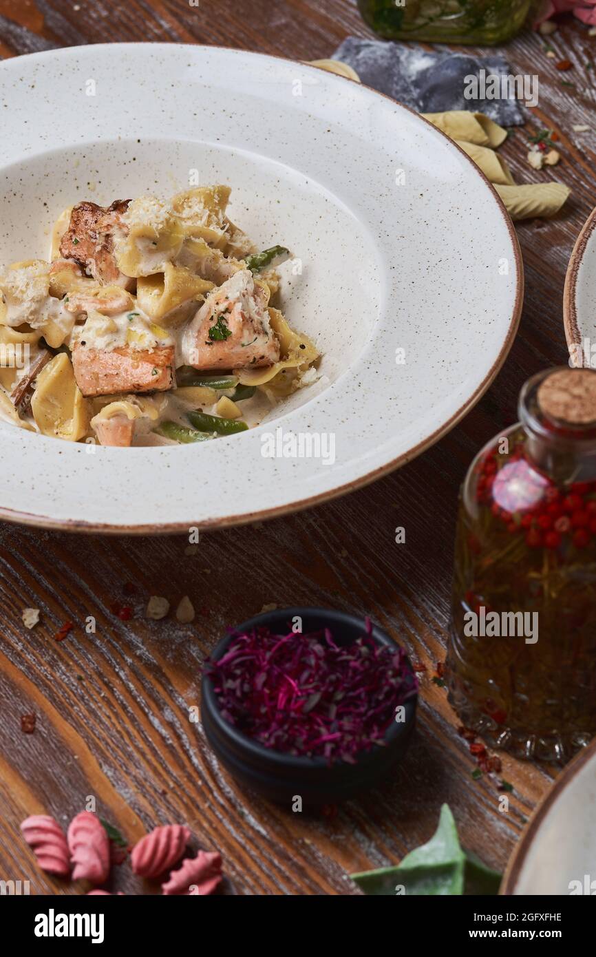 three types of Italian pasta on a wooden table Stock Photo - Alamy