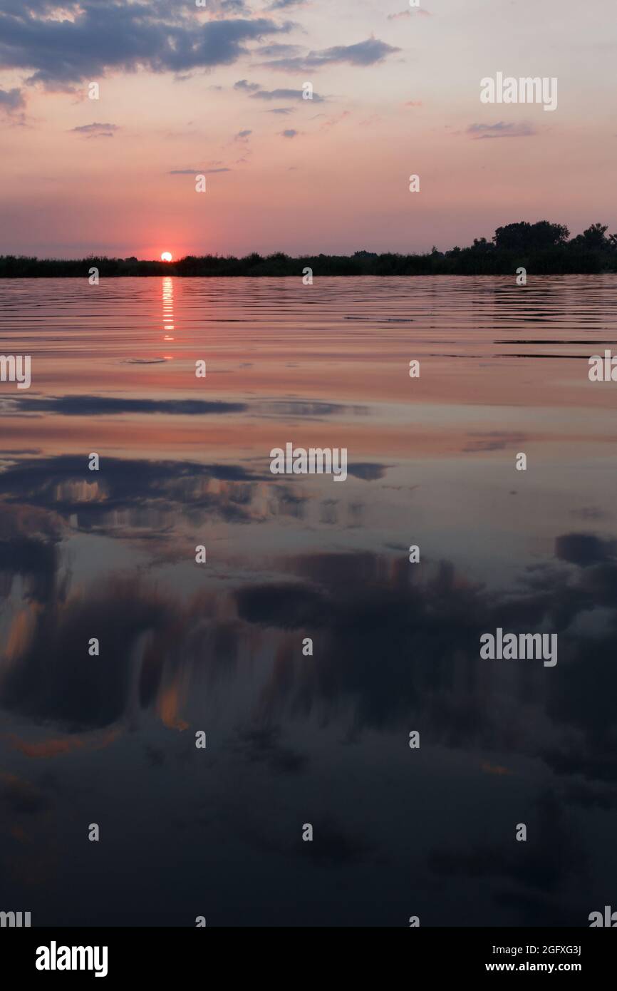 Scarlet sunset on the river, summer time Stock Photo - Alamy