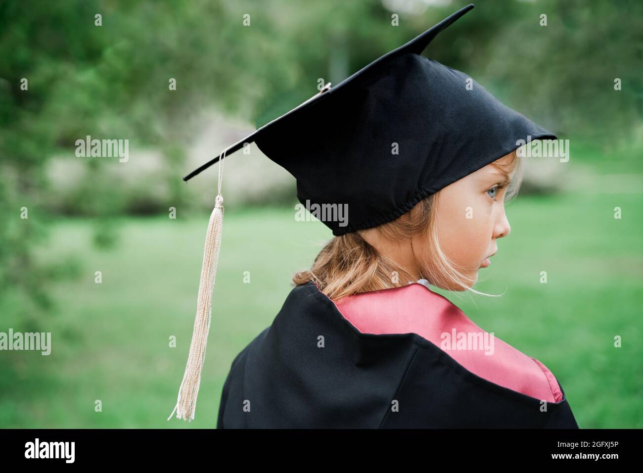 Back to elementary school concept. Little girl goes to first grade ...