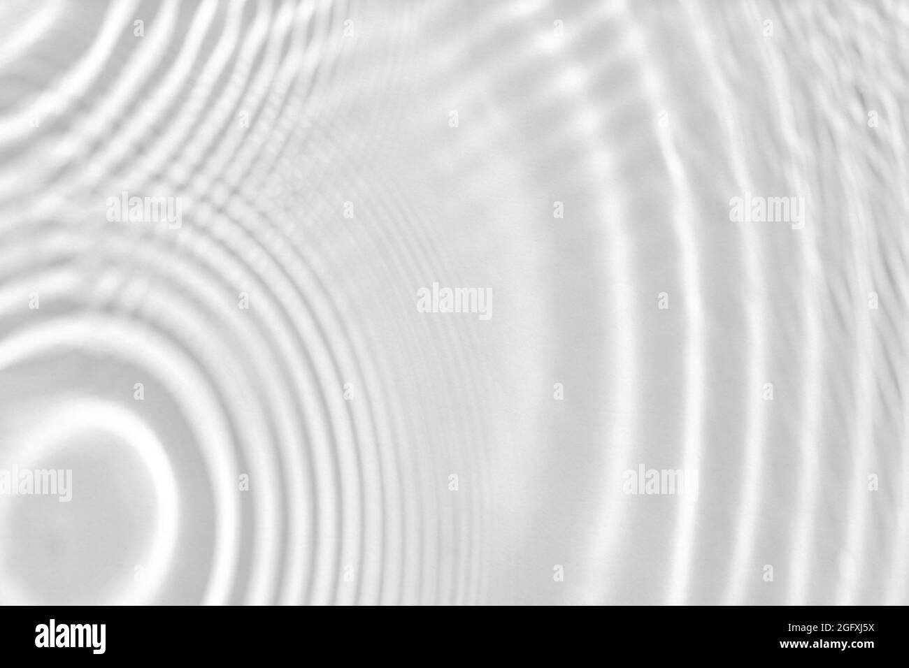 blurred shadow and light caustic effect on a white wall Stock Photo - Alamy