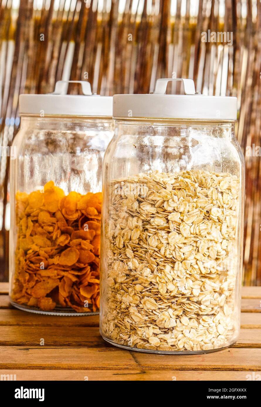 Jars of oat-flakes and cornflakes for yummy breakfast Stock Photo - Alamy