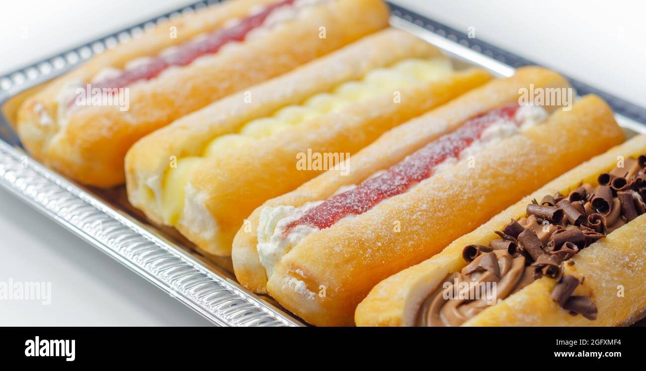 Mixed finger donuts filling chocolate, custard, jam and whipped cream ...