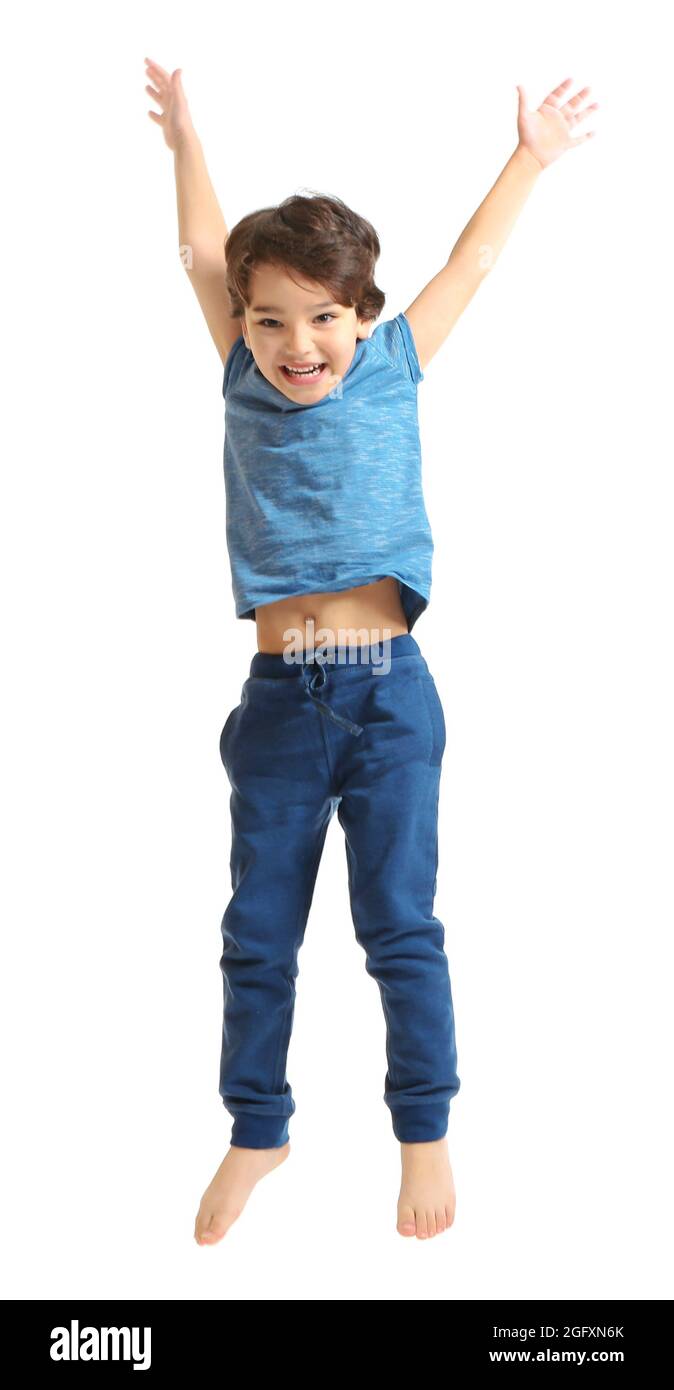 Cute emotional little boy jumping on white background Stock Photo - Alamy