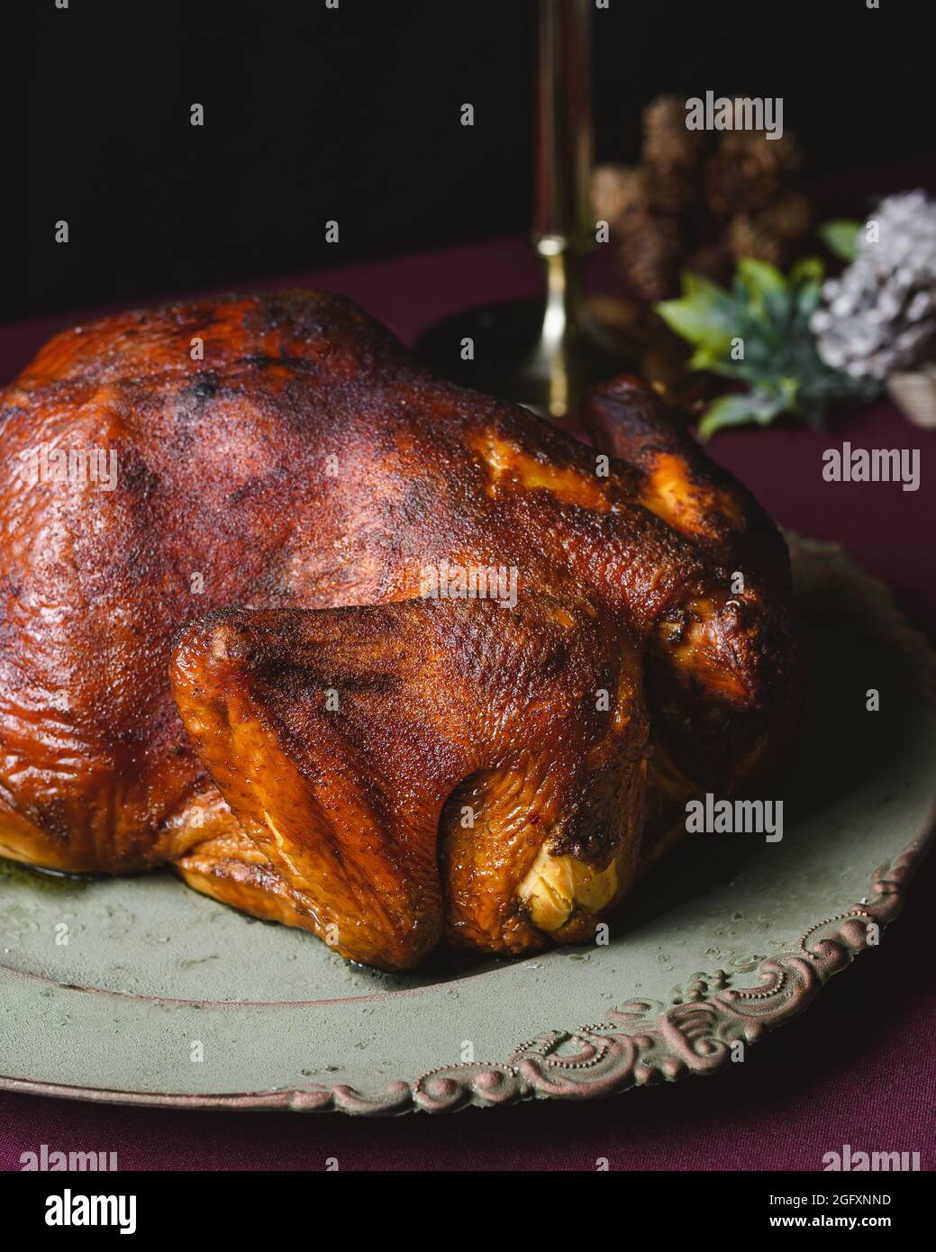 Vertical shot of a delicious roasted Thanksgiving turkey on a plate ...