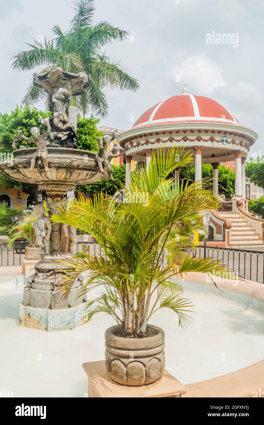 View of a fountain and a gazebo at Parque Central in Granada, Nicaragua ...