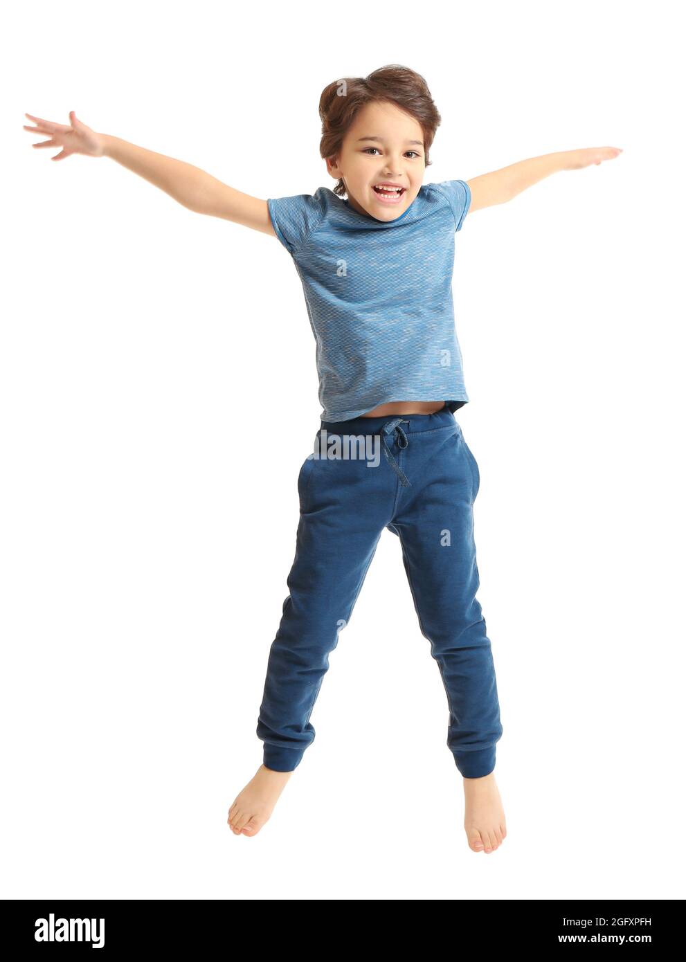Cute emotional little boy jumping on white background Stock Photo - Alamy