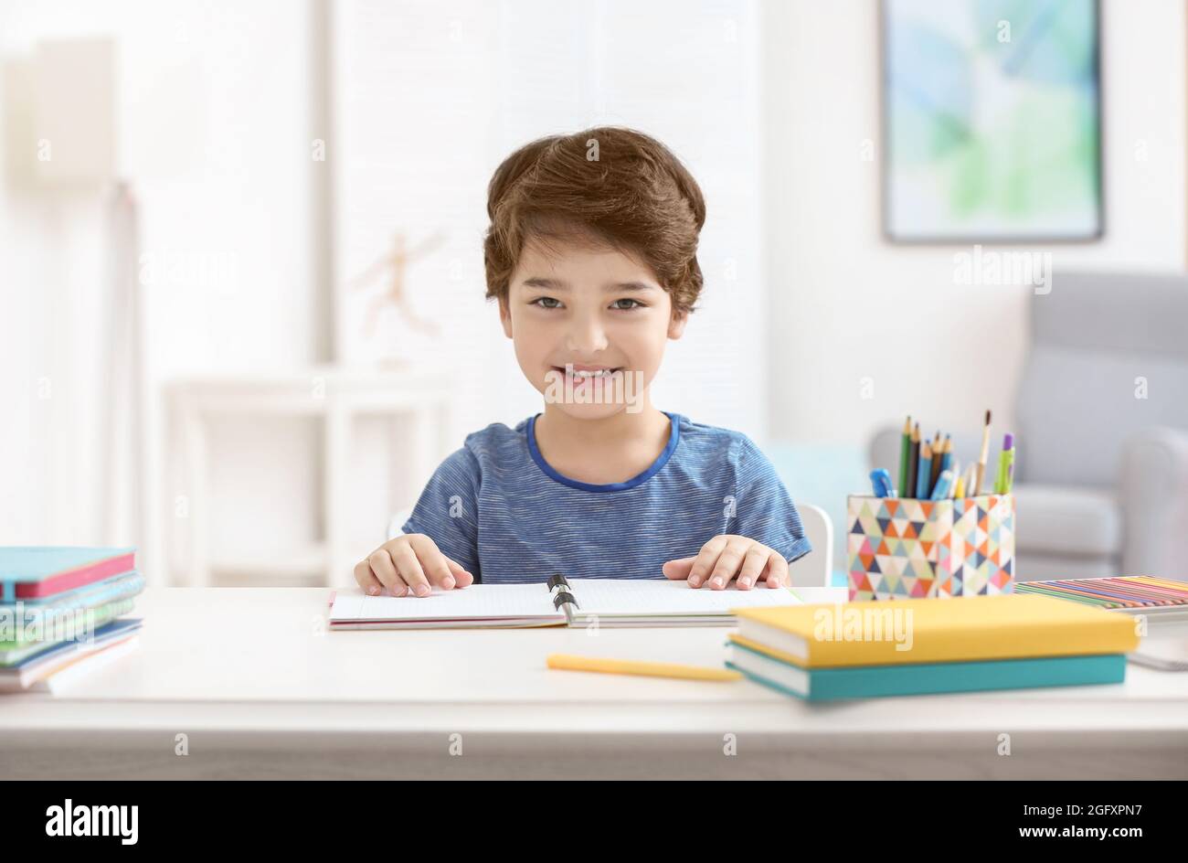 Cute little boy smiling, on blurred background Stock Photo - Alamy