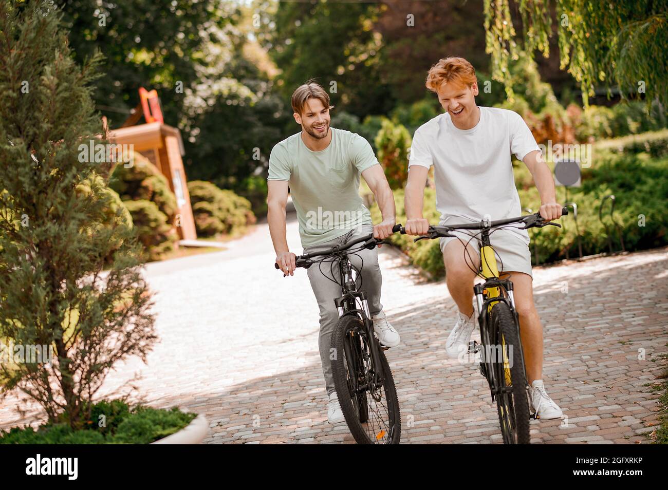 Two male friends enjoying cycling hi-res stock photography and images ...