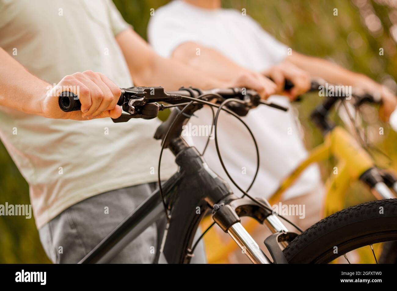 Athletic Caucasian men with their bicycles outdoors Stock Photo - Alamy