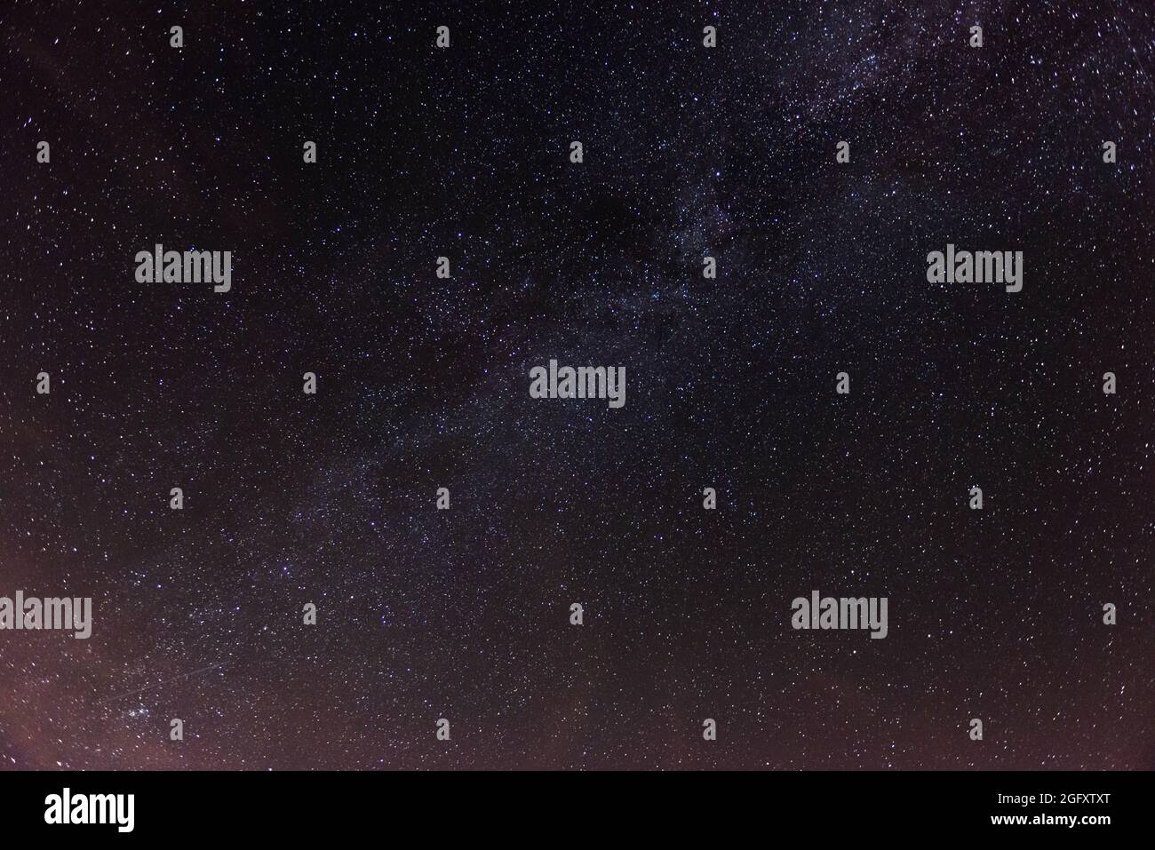 Night cloudless sky. It is covered with points of shining stars. In the ...