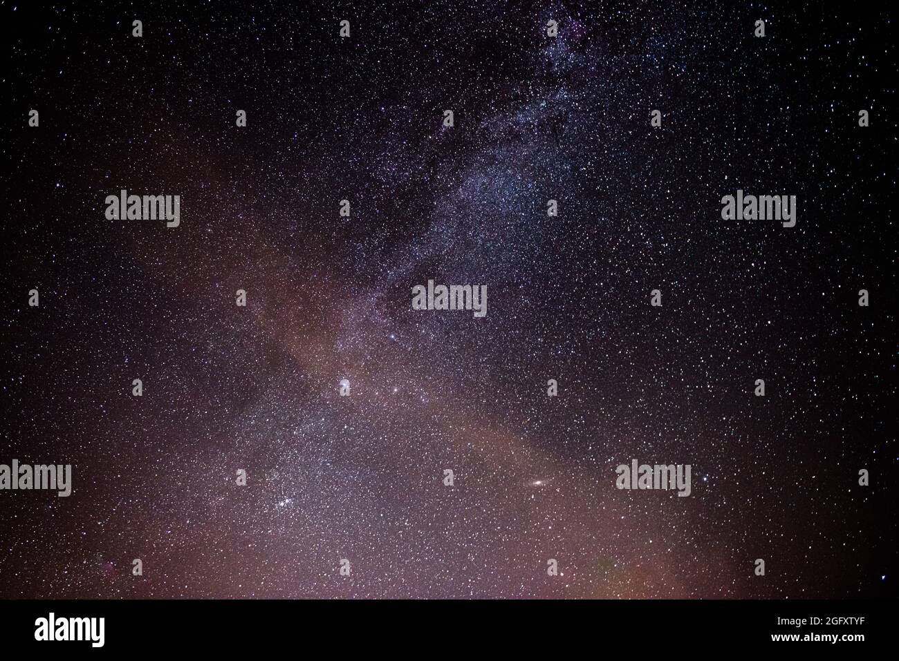 Night cloudless sky. It is covered with points of shining stars. In the ...
