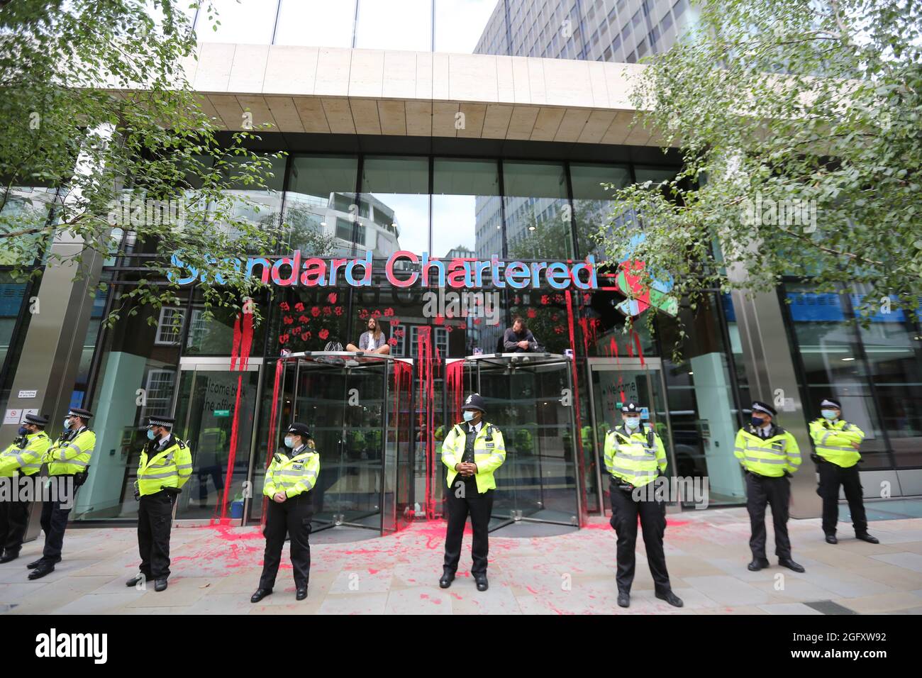 London, England, UK. 27th Aug, 2021. Money Rebellion activists painted ...