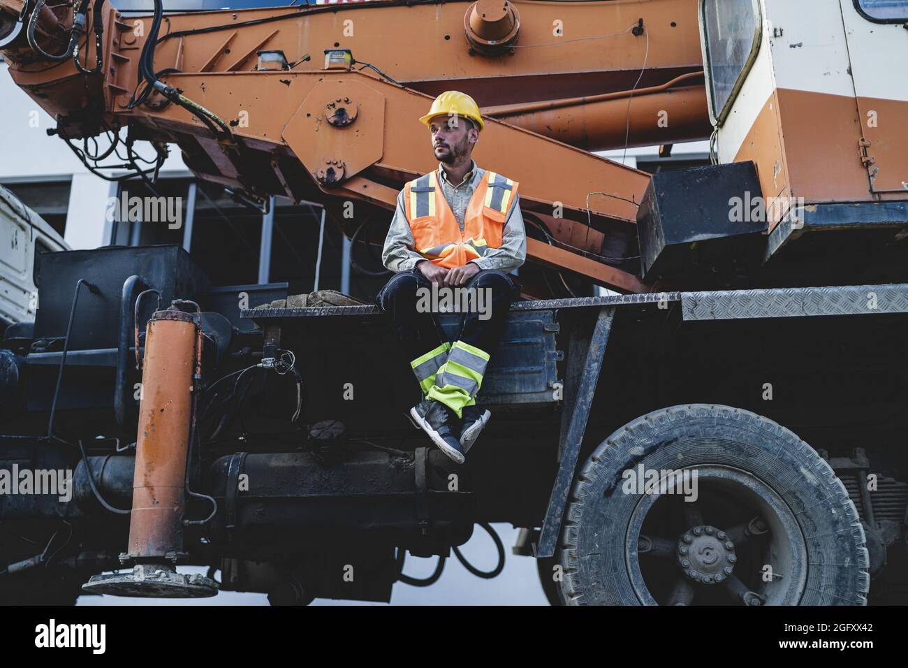 Man sitting on crane hi-res stock photography and images - Alamy