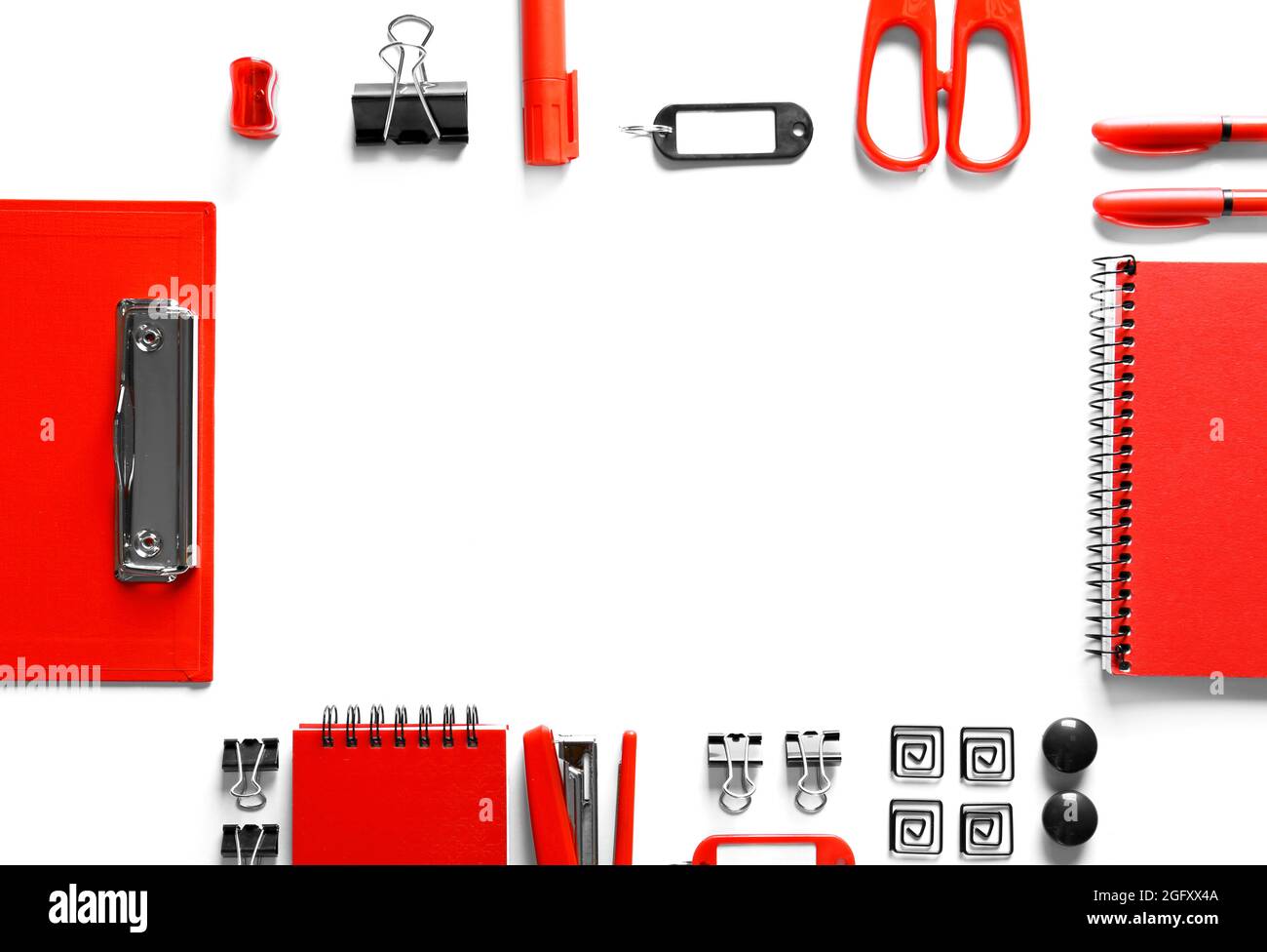 Flat lay of red stationery on white background Stock Photo - Alamy