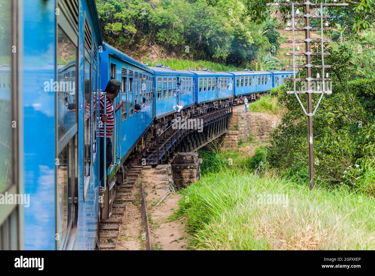 BANDARAWELA, SRI LANKA - JULY 15, 2016: Train rides through mountains ...