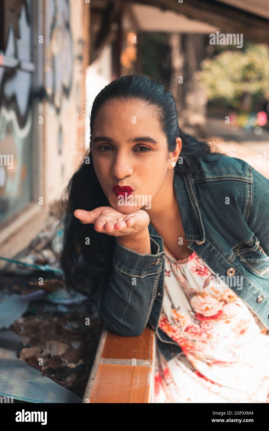 Vertical shot of a latin female throwing a kiss Stock Photo - Alamy