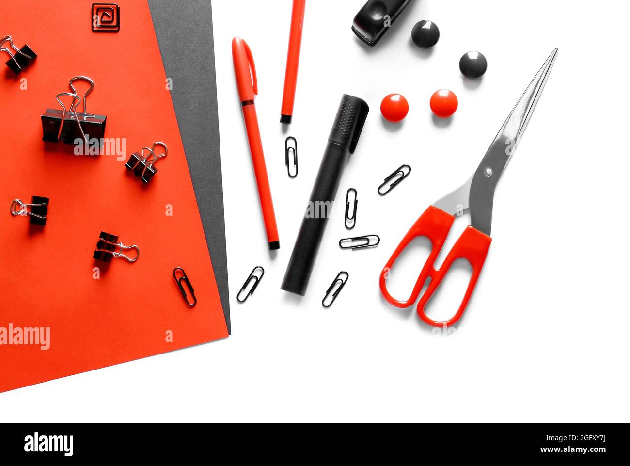 Red and black stationery on white background Stock Photo - Alamy