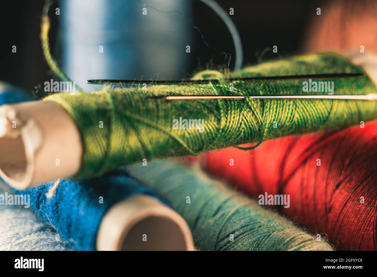 Vertical shot of colorful thread stocks piled one on another Stock ...