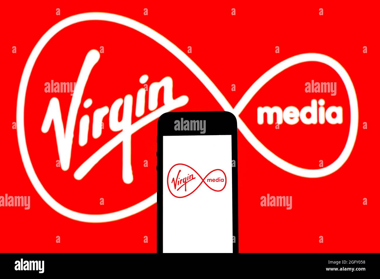 In this photo illustration a Virgin Media Inc logo seen displayed on a ...