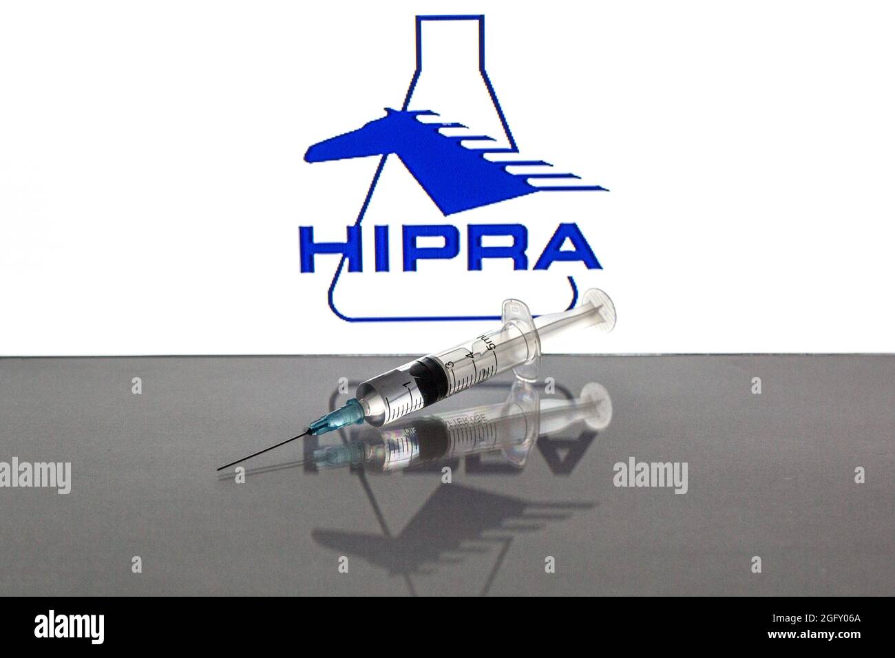 In this photo illustration, a close up of a medical syringe in front of ...