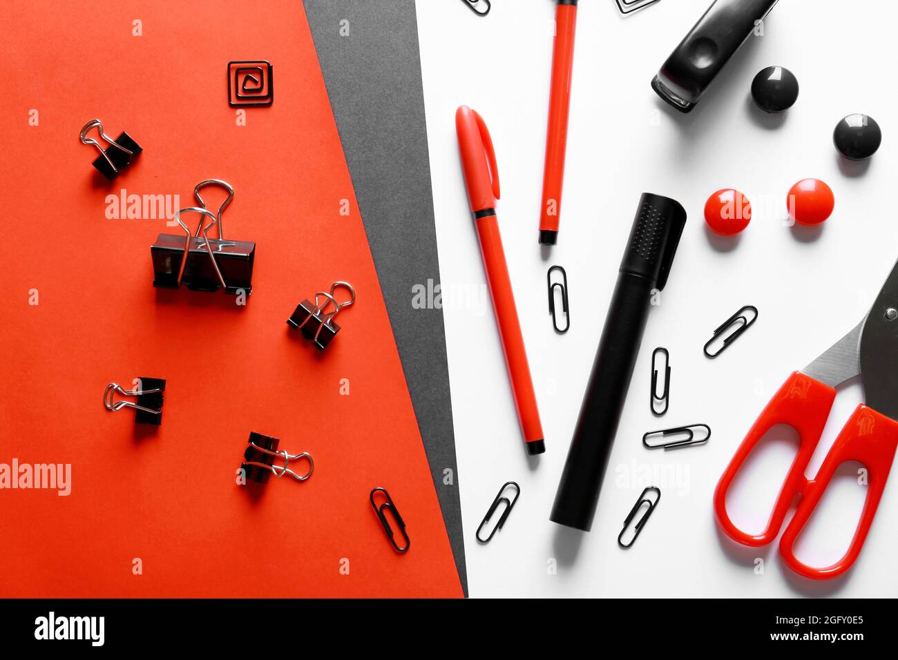Red and black stationery on white background Stock Photo - Alamy