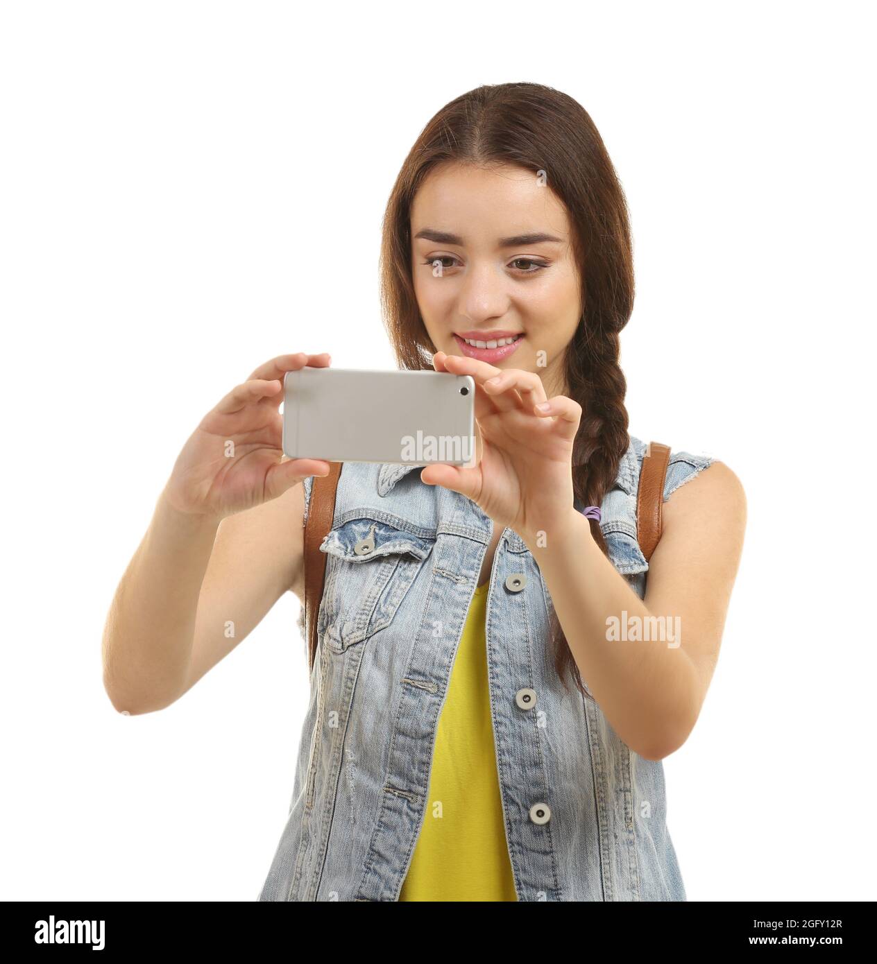 Beautiful woman taking photo using mobile phone, on white background ...