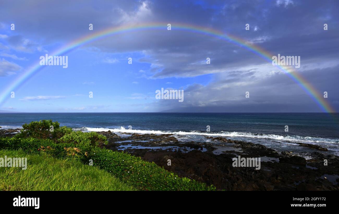 Rainbow over the Pacific on Maui's Napili Bay looking across the ...