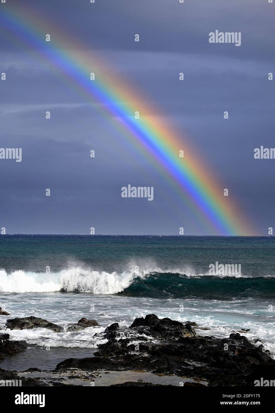 Rainbow over the Pacific on Maui's Napili Bay looking across the ...