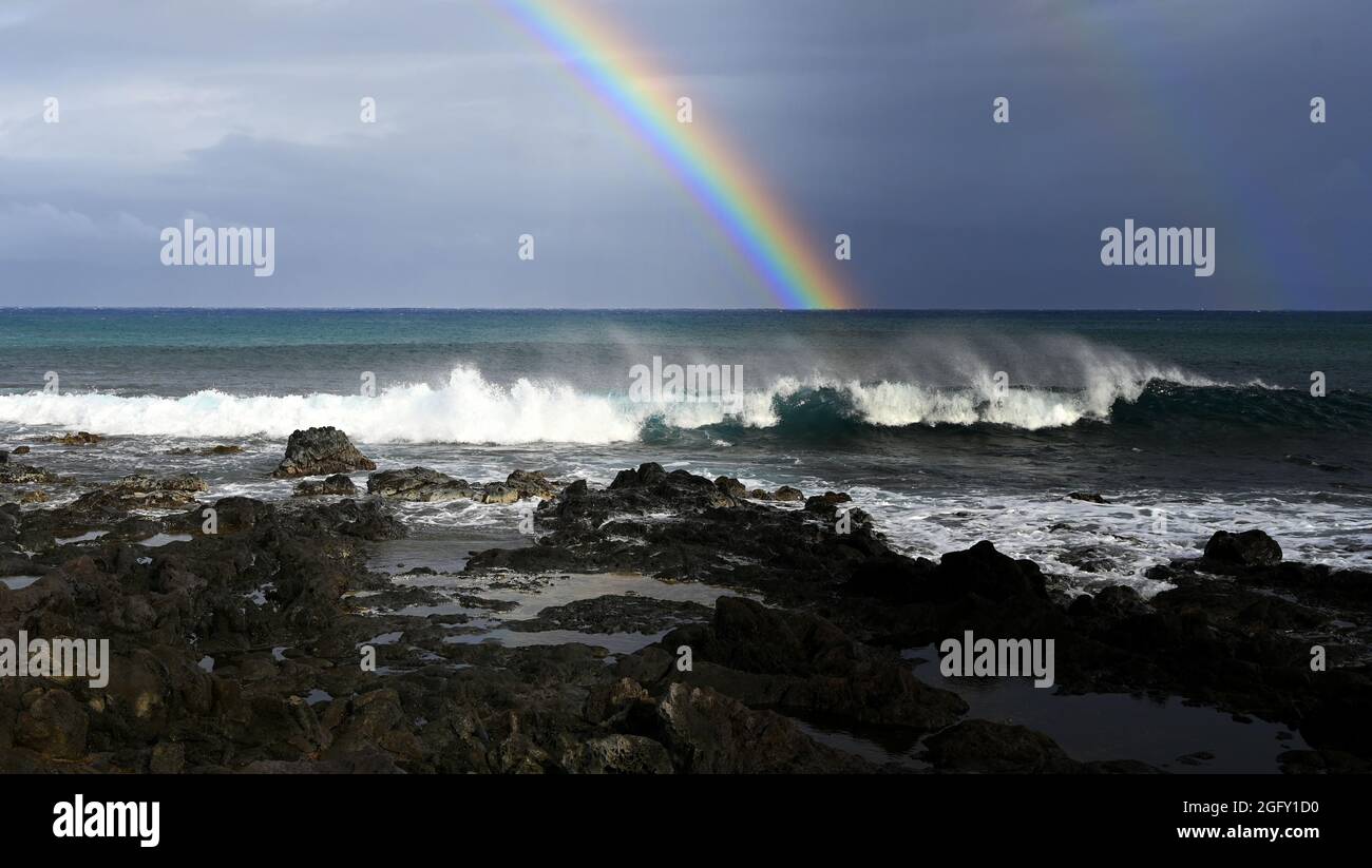 Rainbow over the Pacific on Maui's Napili Bay looking across the ...