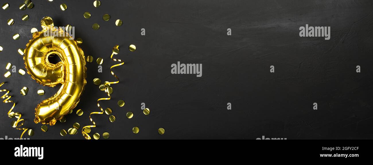 gold foil balloon number nine or ninth. Birthday greeting card with the inscription 9. black ...