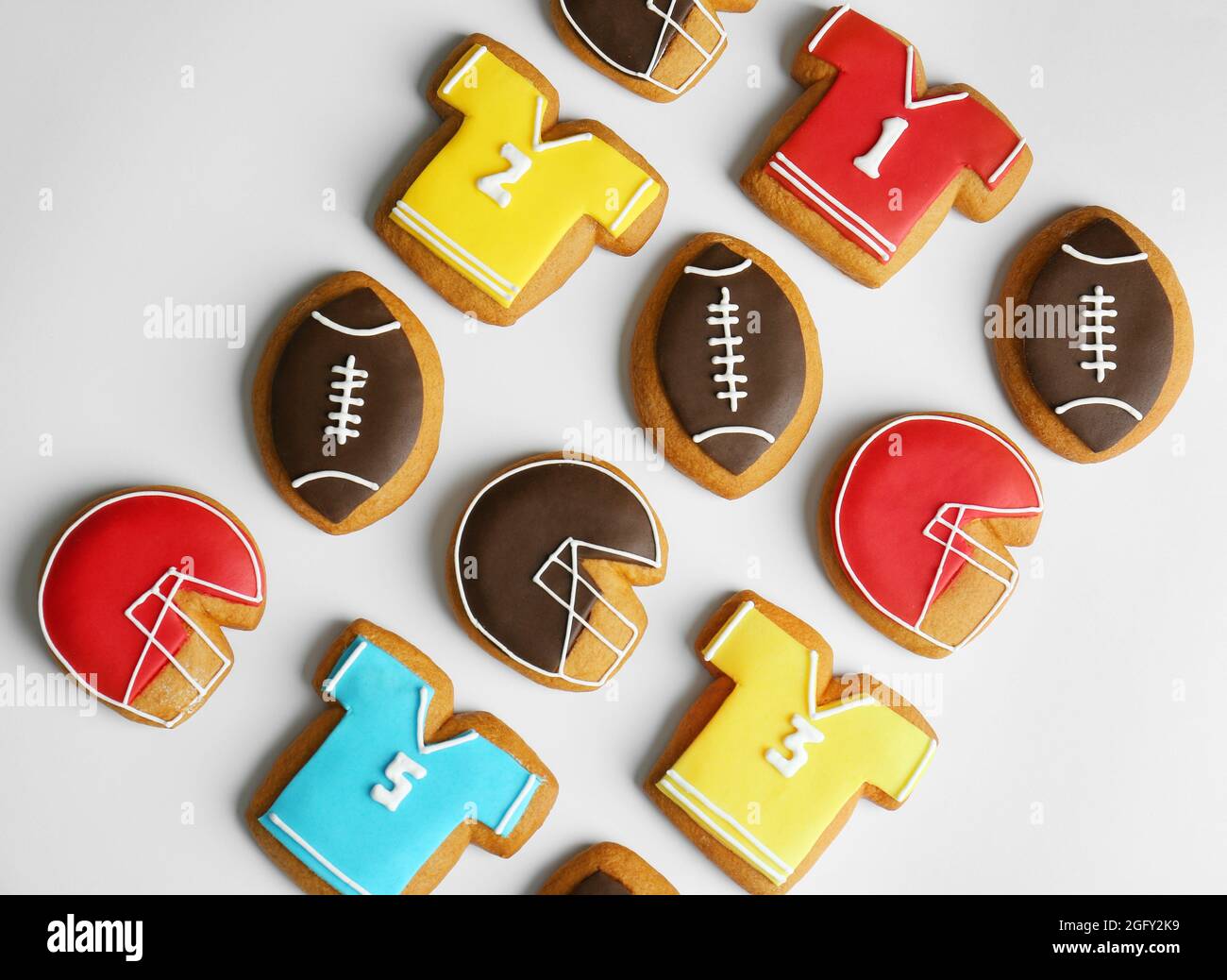 Delicious gingerbread cookies decorated with football signs on white ...