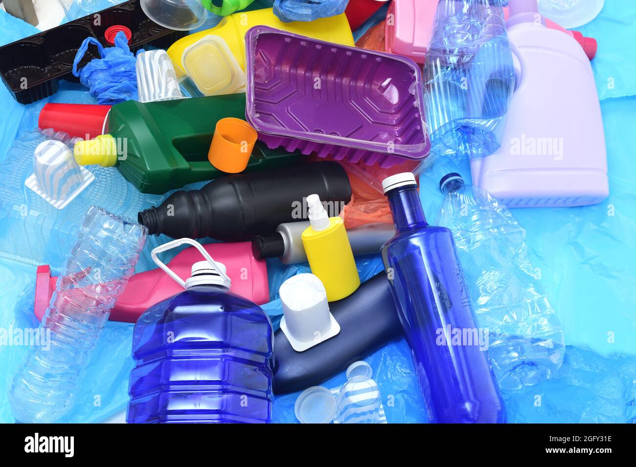 group of plastic containers on blue plastic bags Stock Photo - Alamy