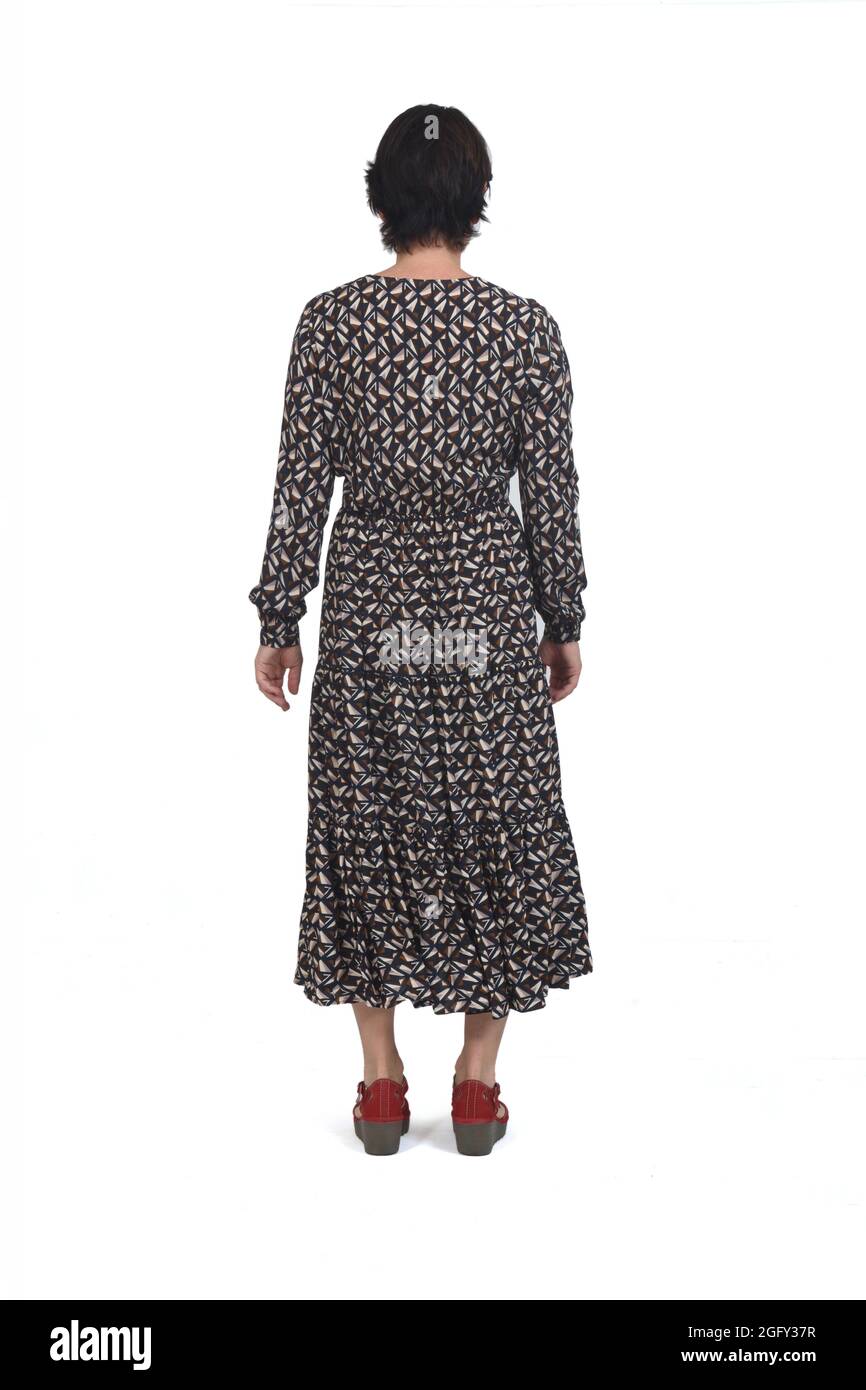 back view of a full portrait of a woman with long dress on white ...