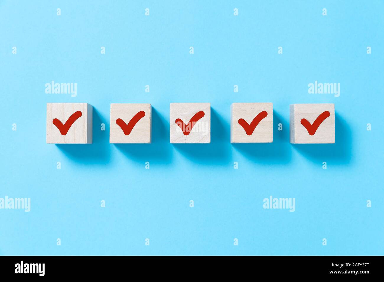 Red tick marking on checklist Stock Photo - Alamy