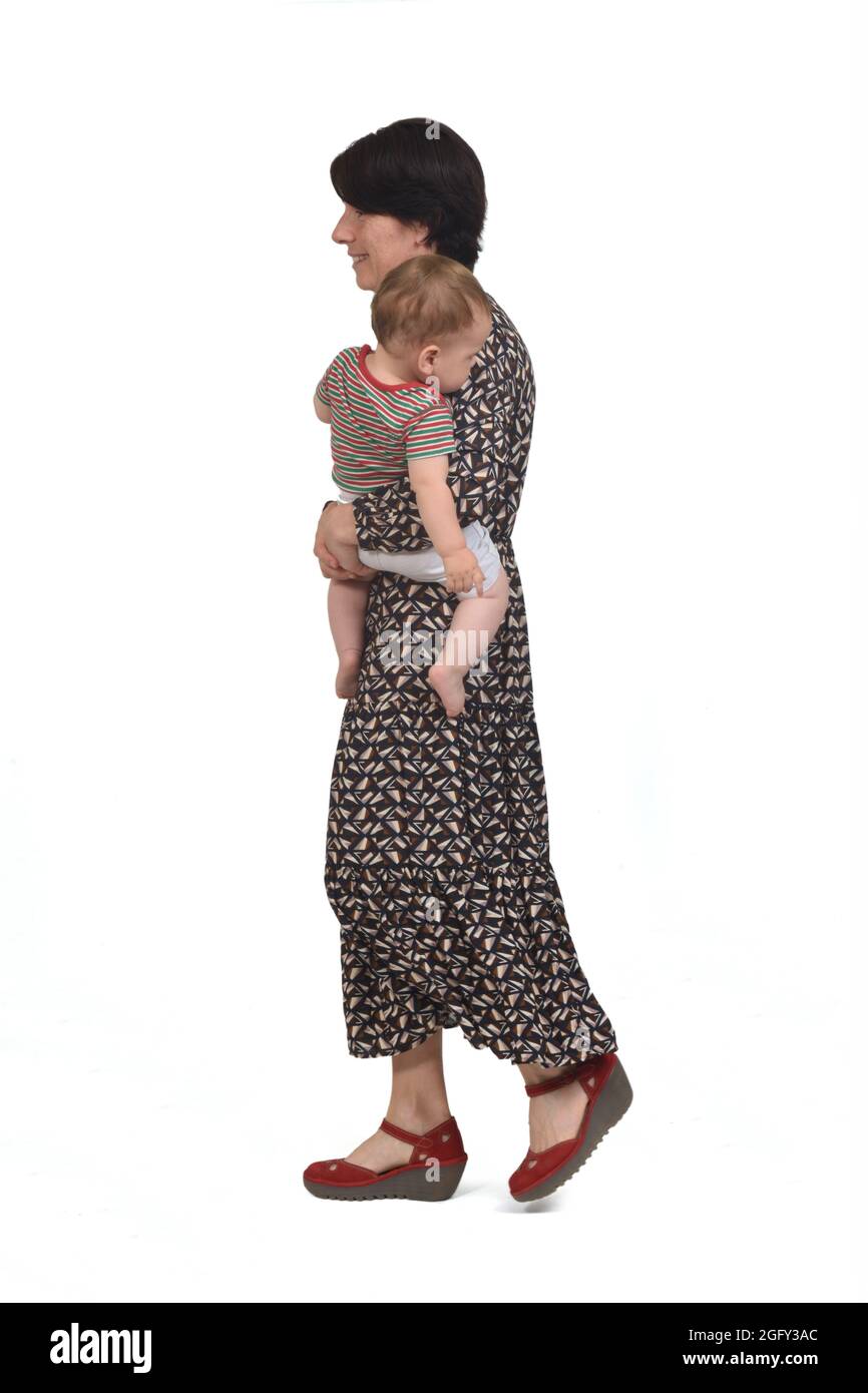 mother carrying her baby walking on white background Stock Photo - Alamy