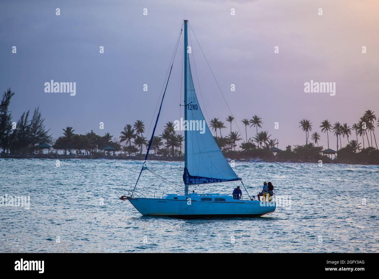 People sailing a boat near the shore of San Juan - Puerto Rico Stock ...