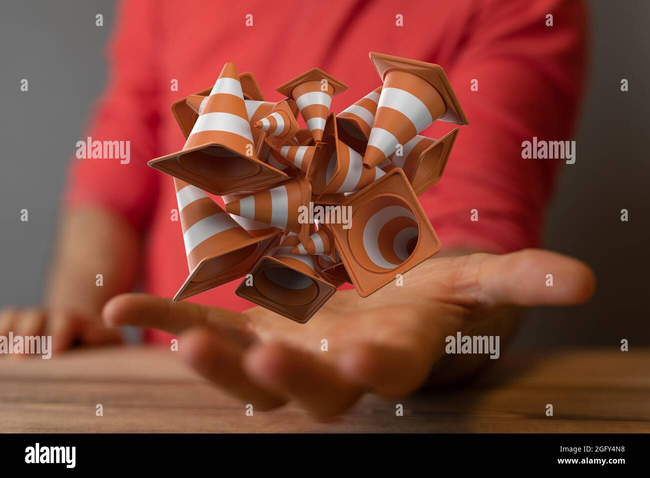 Closeup of a 3D rendered bunch of under construction signs in a man's ...
