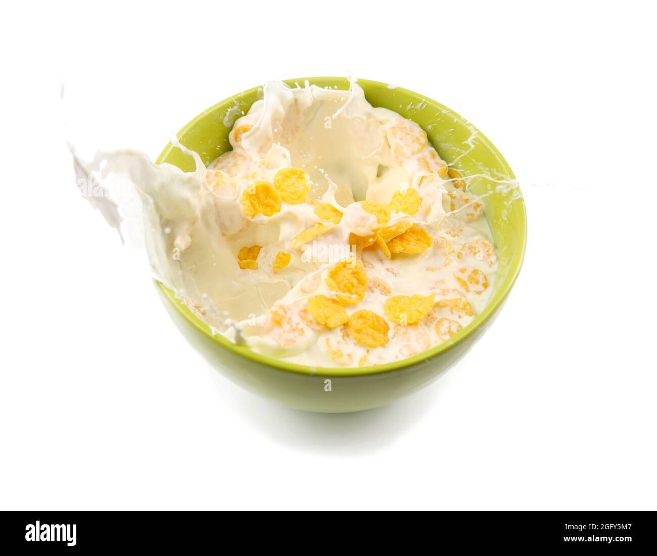 Corn flakes in bowl with milk splash on white background Stock Photo ...