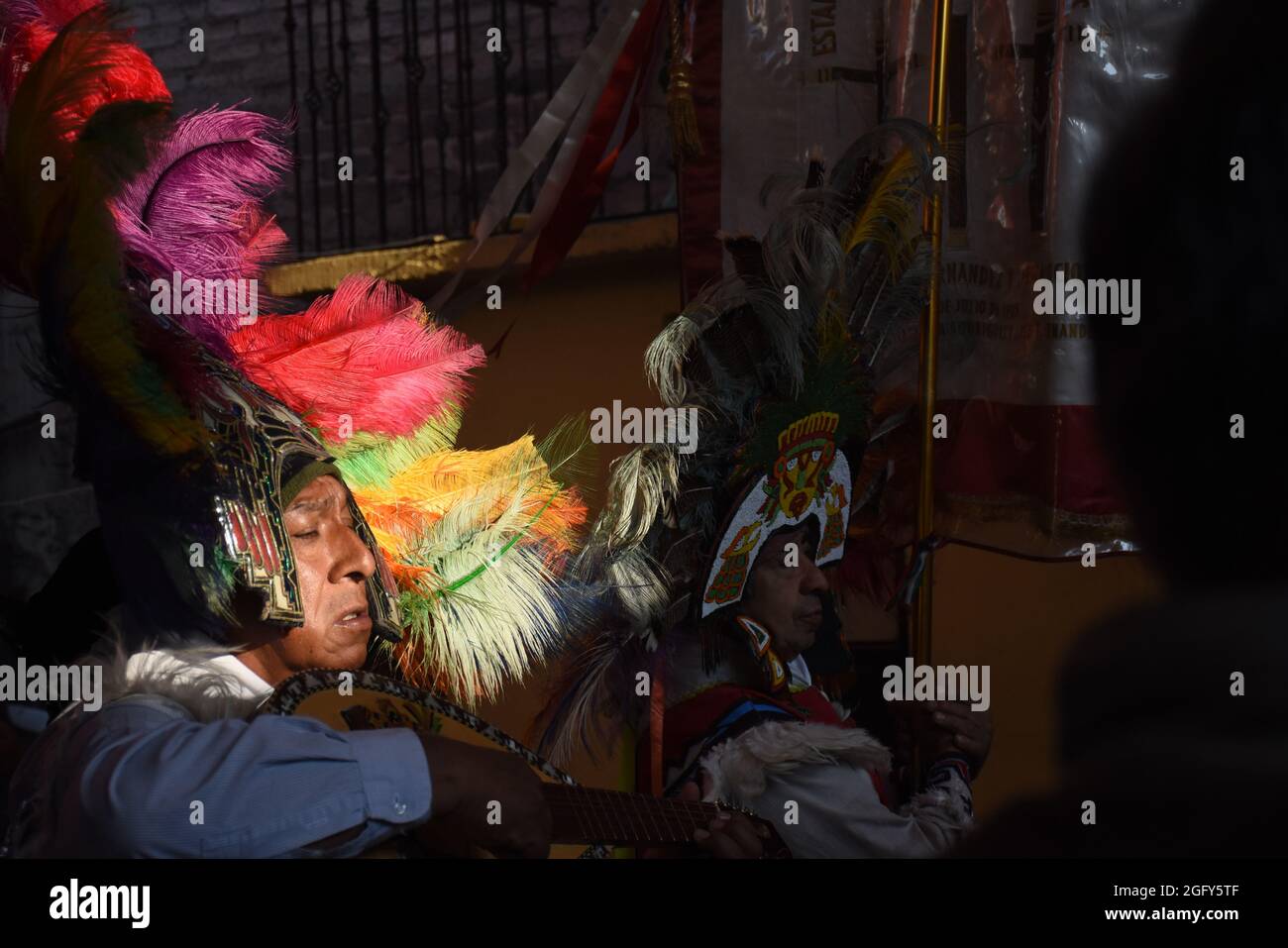 Concheros are traditional musicians and dancers who dress in ...