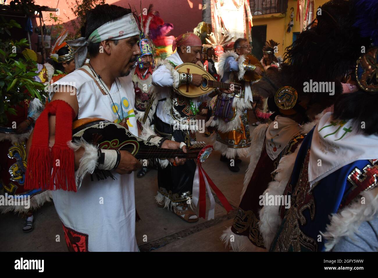Concheros are traditional musicians and dancers who dress in ...