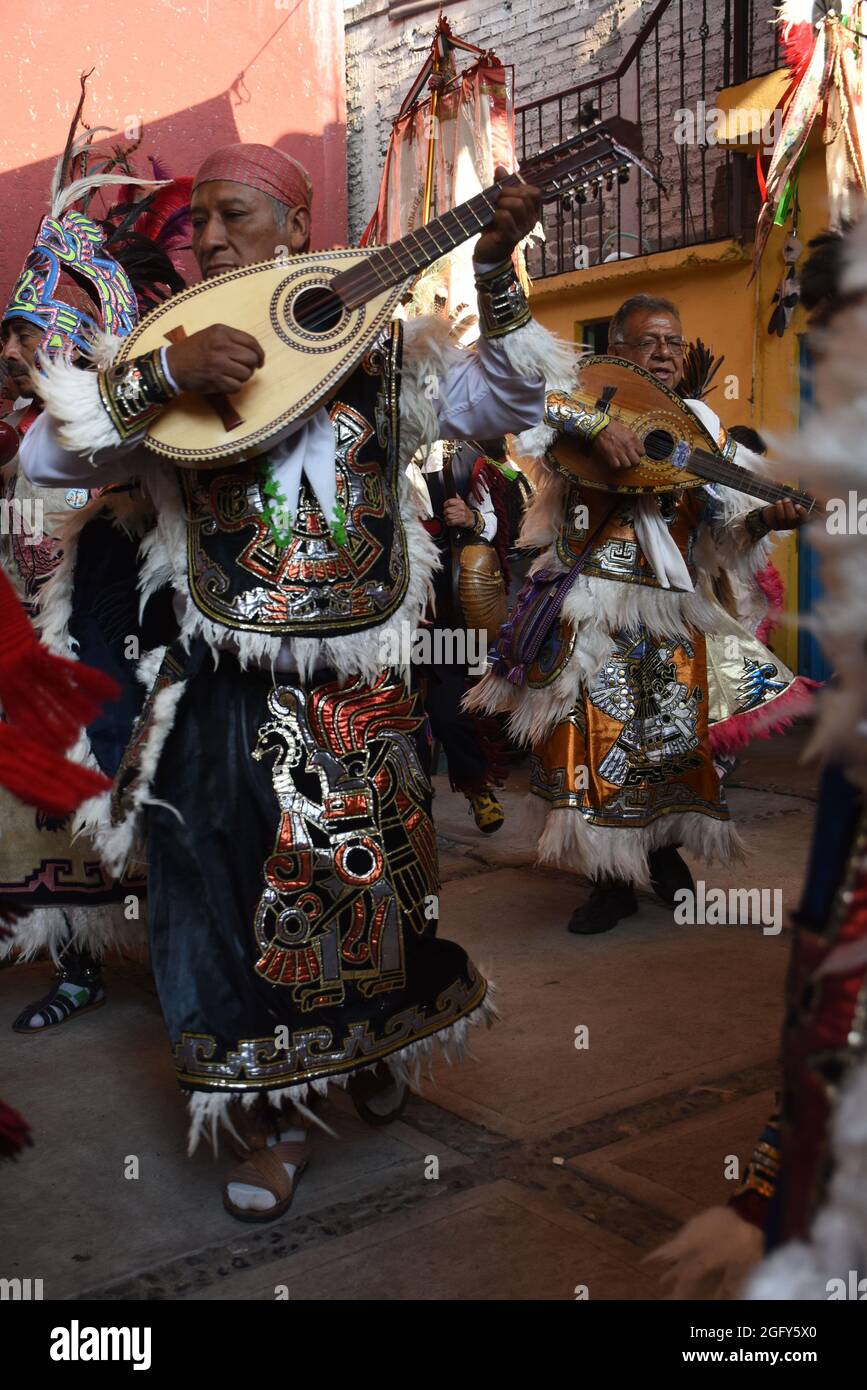 Concheros are traditional musicians and dancers who dress in ...